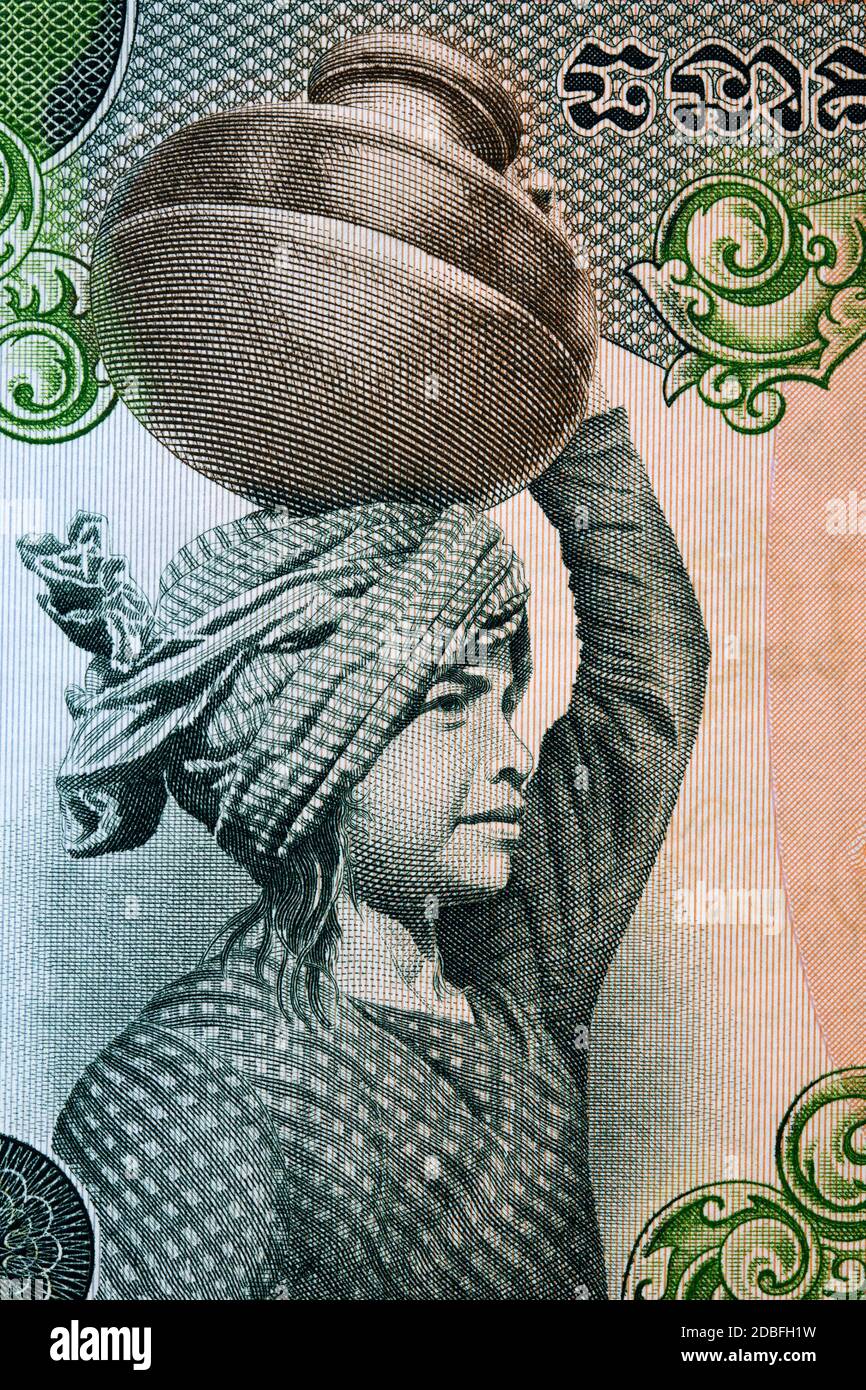 Girl carrying a pitcher on her head from Cambodian money Stock Photo ...