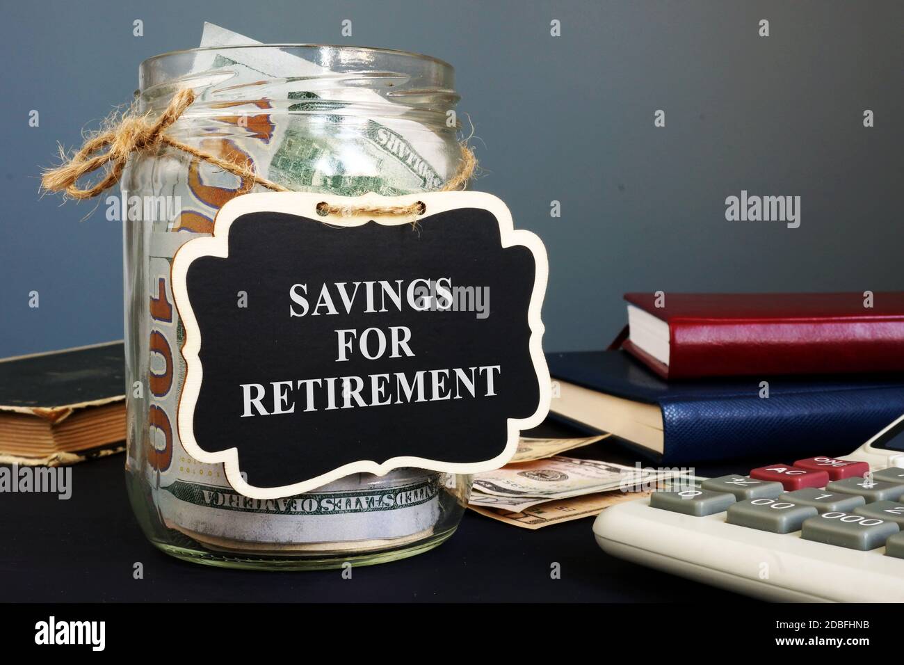 Savings for retirement sign on the jar with money Stock Photo - Alamy