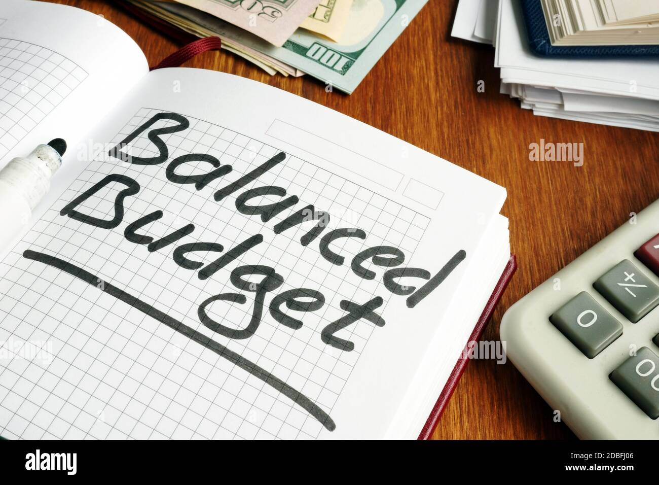 Balanced Budget calculations in the notepad Stock Photo - Alamy