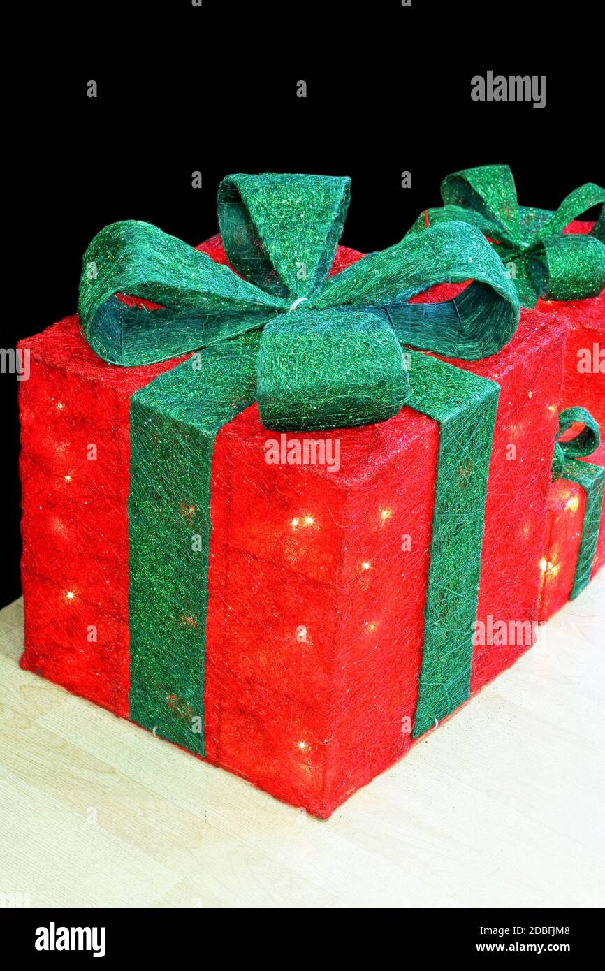 Big red gift box with green bow Stock Photo - Alamy
