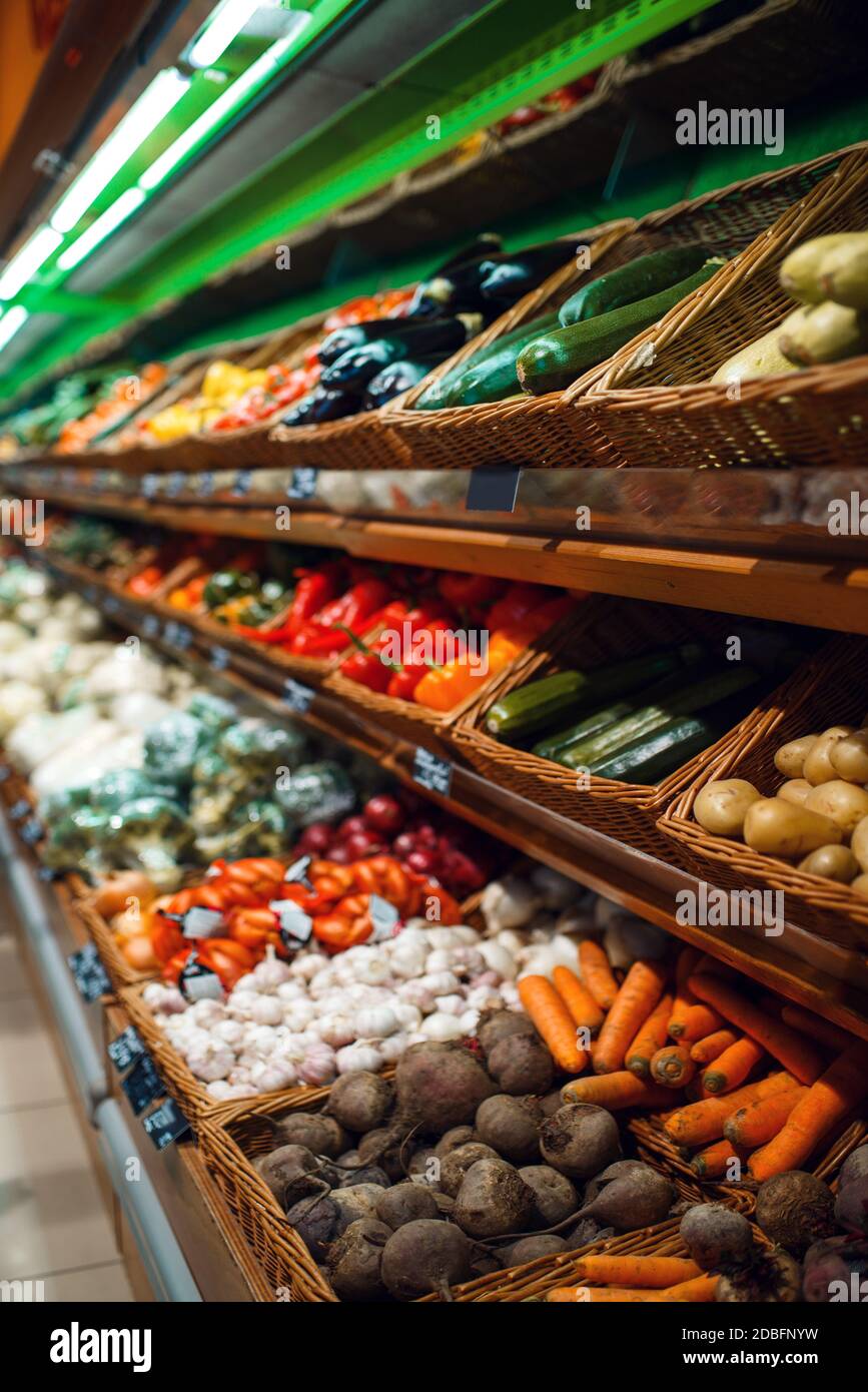 Showcase with fresh fruits and vegetables in grocery store, nobody ...