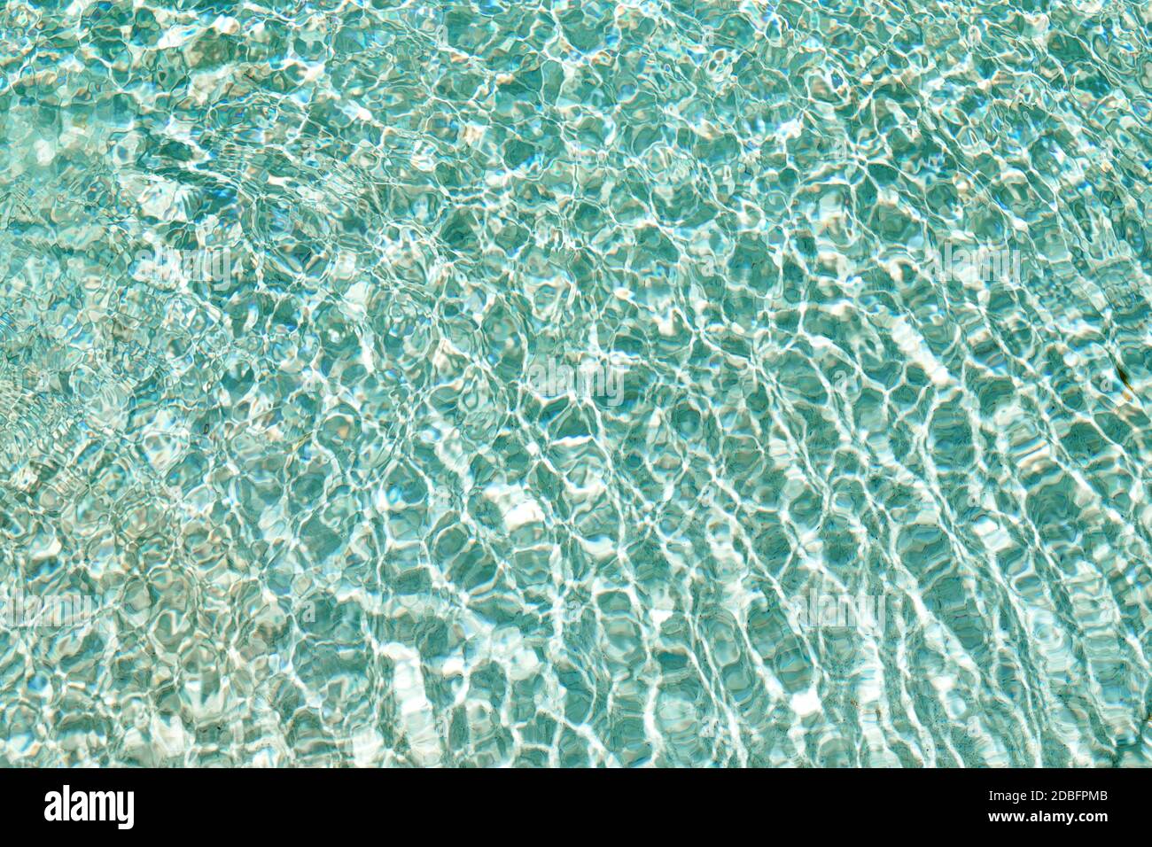 Ripple Water in swimming pool with sun reflection Stock Photo - Alamy