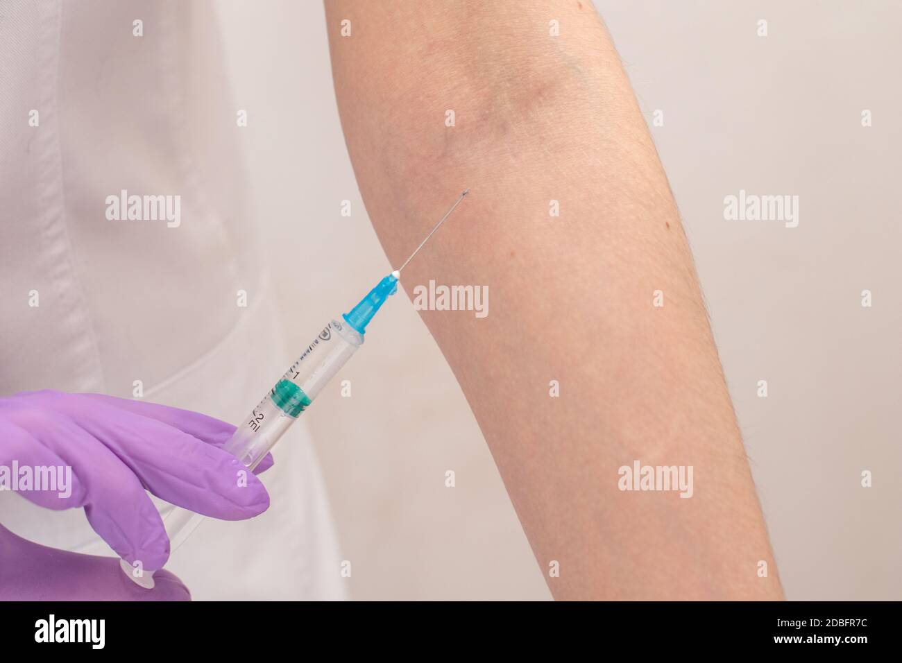Close up nurse hands on gloves makes an injection to hand patient Stock ...