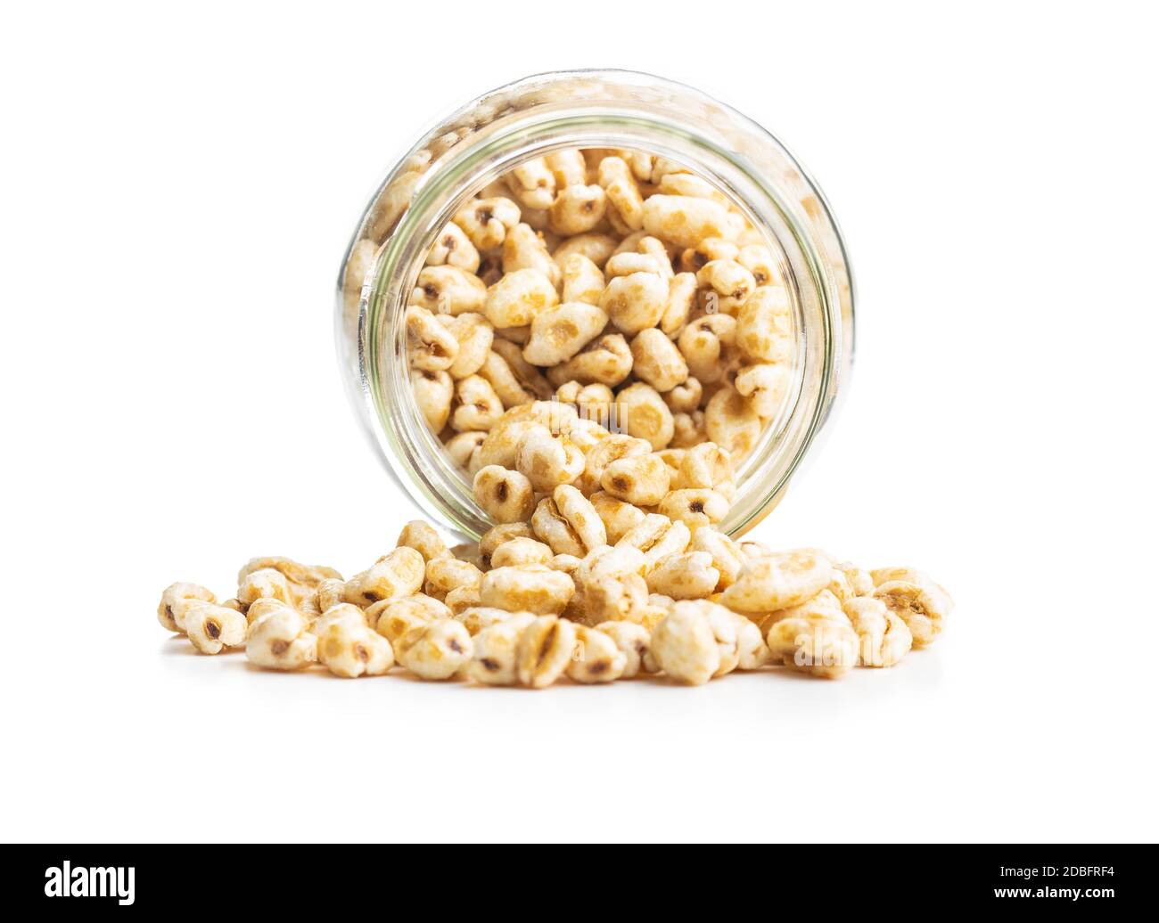 Puffed wheat covered with honey in jar isolated on white background ...