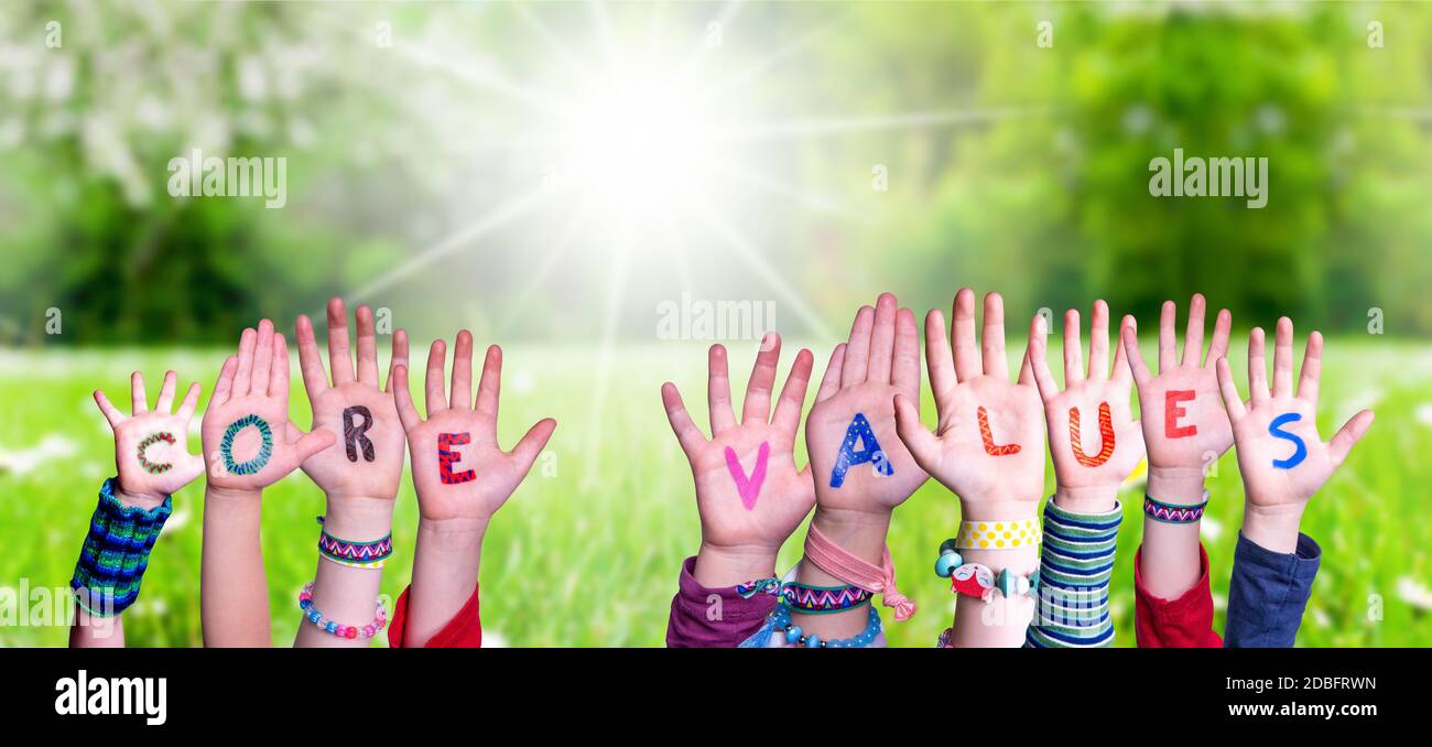 Children Hands Building Colorful Word Core Values. Sunny Green Grass ...