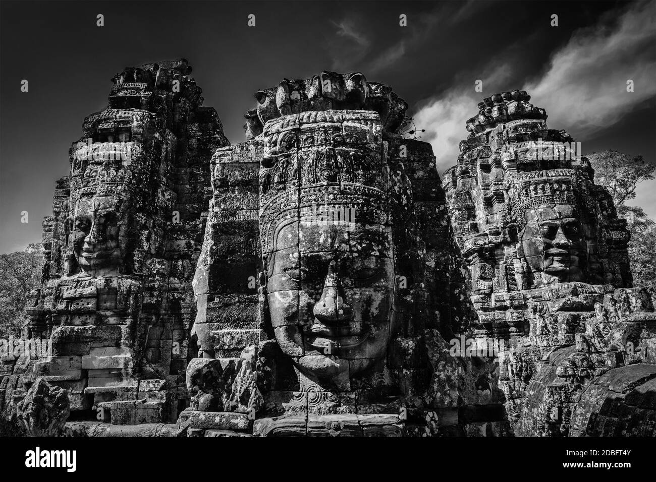 Ancient stone faces of Bayon temple, Angkor, Cambodia. Black and white ...