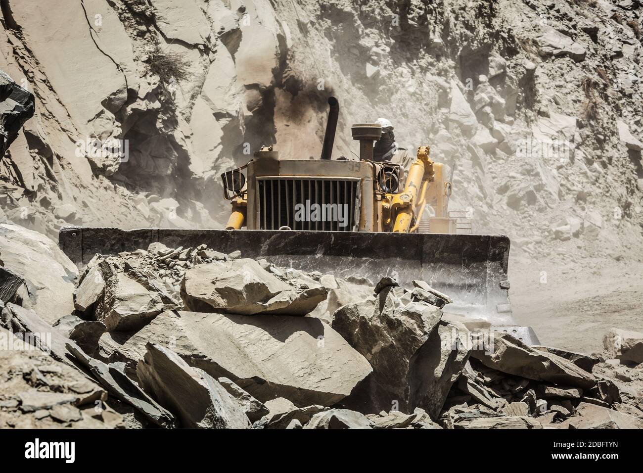 Bulldozer doing mountain road construction in Himalayas. Himachal ...