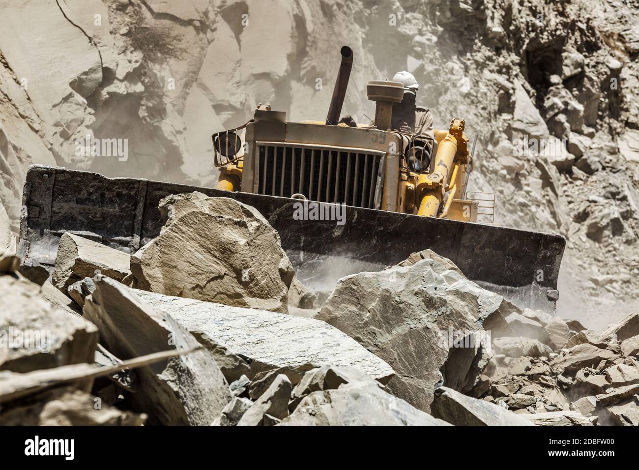 Bulldozer doing mountain road construction in Himalayas. Himachal ...