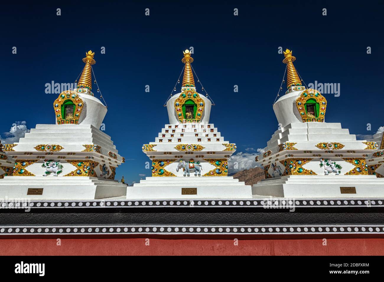 White chortens (Buddhist stupas) in Thiksey gompa. Ladakh, Jammu and ...