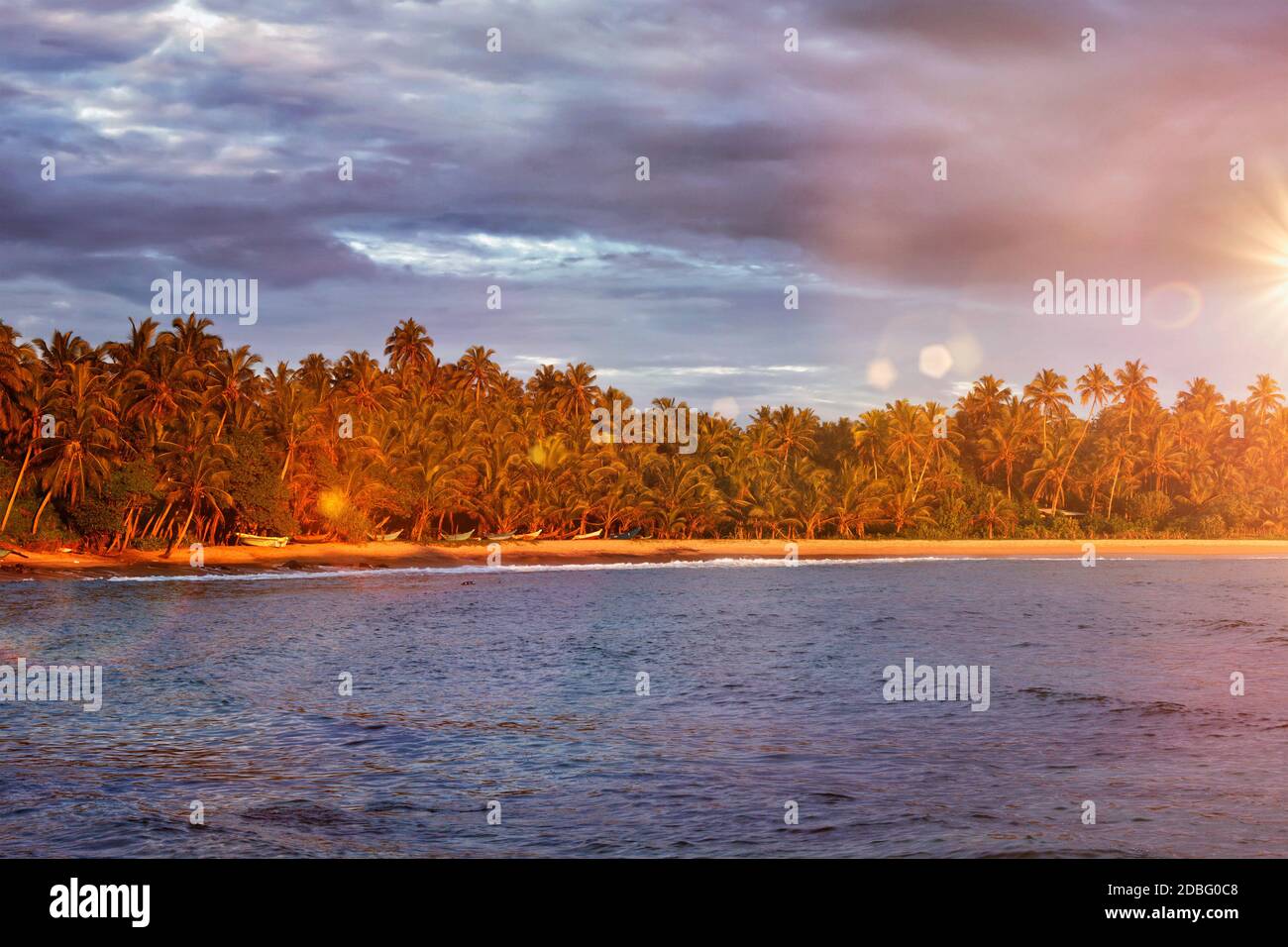 Fishing boats on beach on sunset. Mirissa, Sri Lanka Stock Photo - Alamy