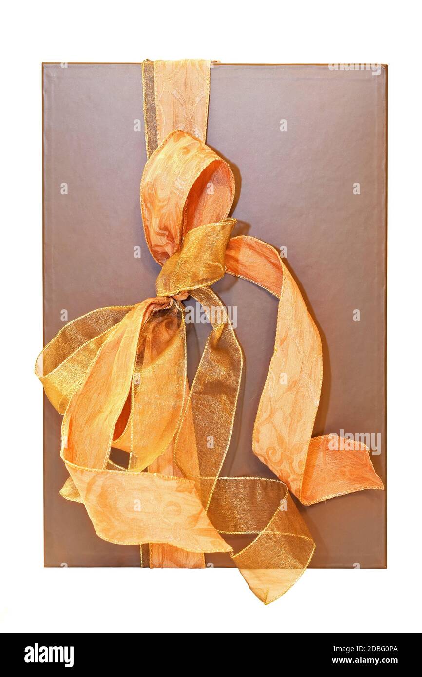 Big gift box with shiny golden ribbon Stock Photo - Alamy