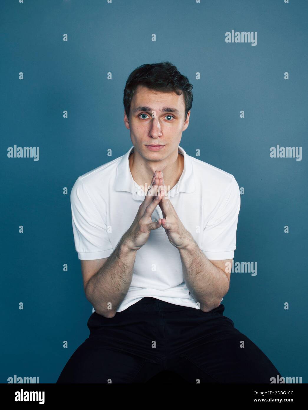 young goofy man with pimples pointing gesturing in studio, stupid ...