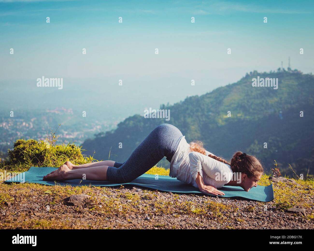 Vintage retro effect hipster style image of woman doing yoga asana ...