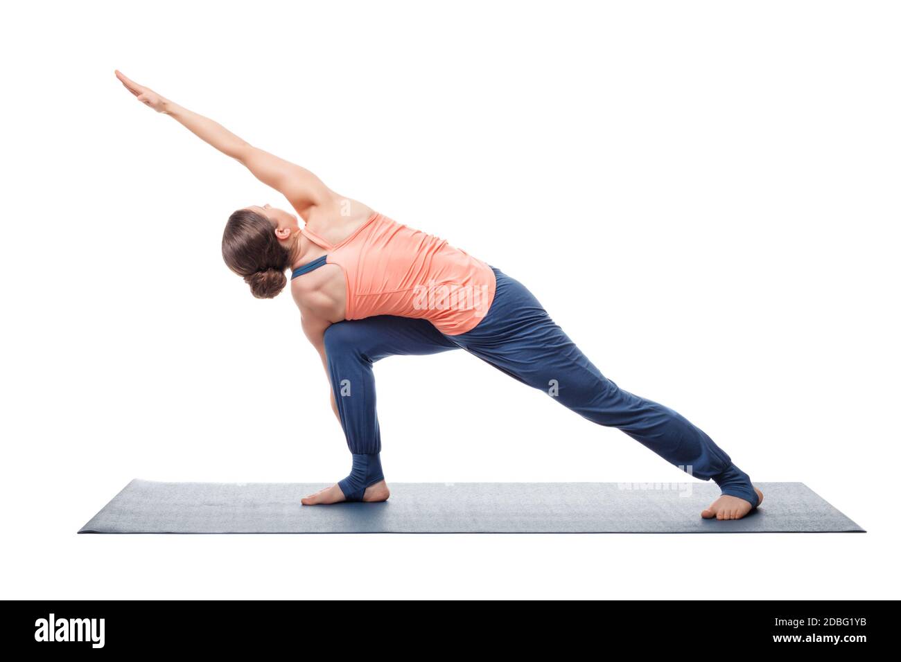 Young fit woman doing Ashtanga Vinyasa Yoga asana Parivritta ...