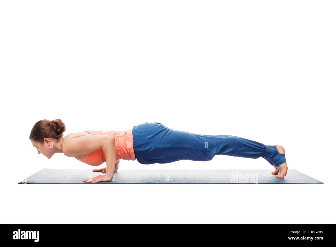 Woman doing Ashtanga Vinyasa Yoga asana Chaturanga Dandasana - four ...