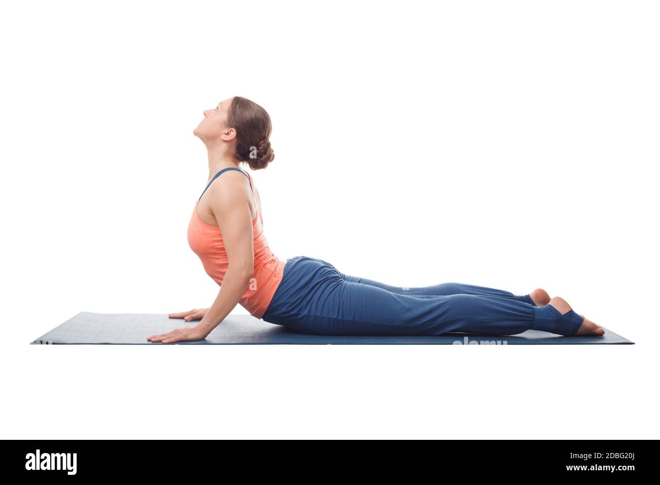 Beautiful sporty fit yogini woman practices yoga asana bhujangasana ...