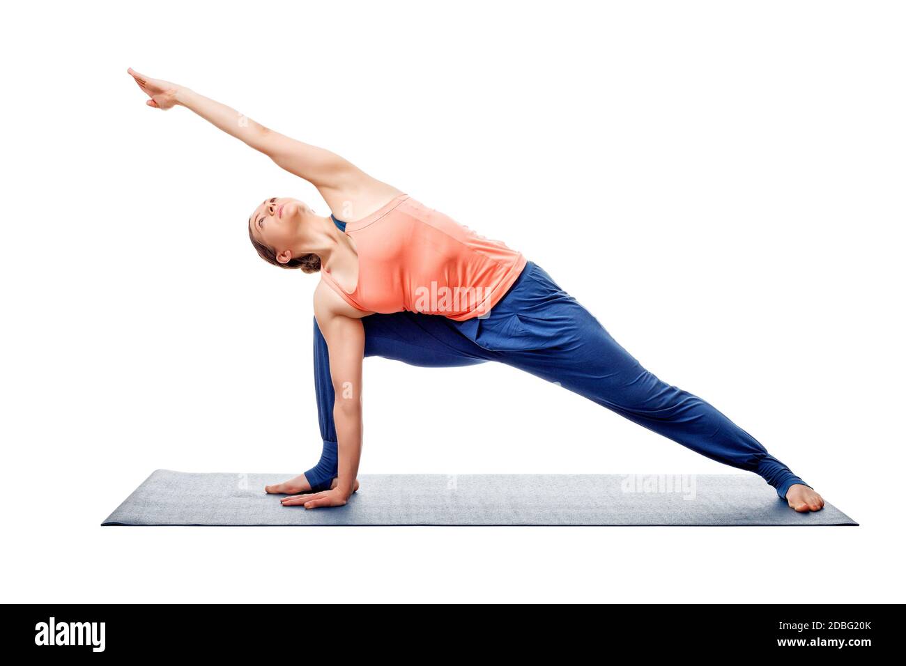 Young fit woman doing Ashtanga Vinyasa Yoga asana Utthita ...