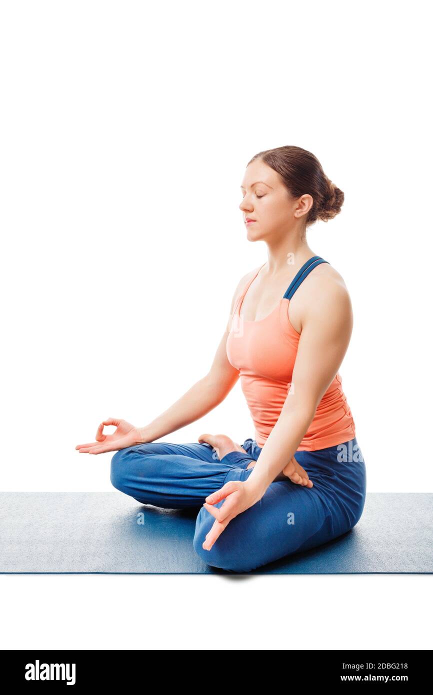 Woman doing Yoga meditation asana Padmasana - lotus pose posture with ...