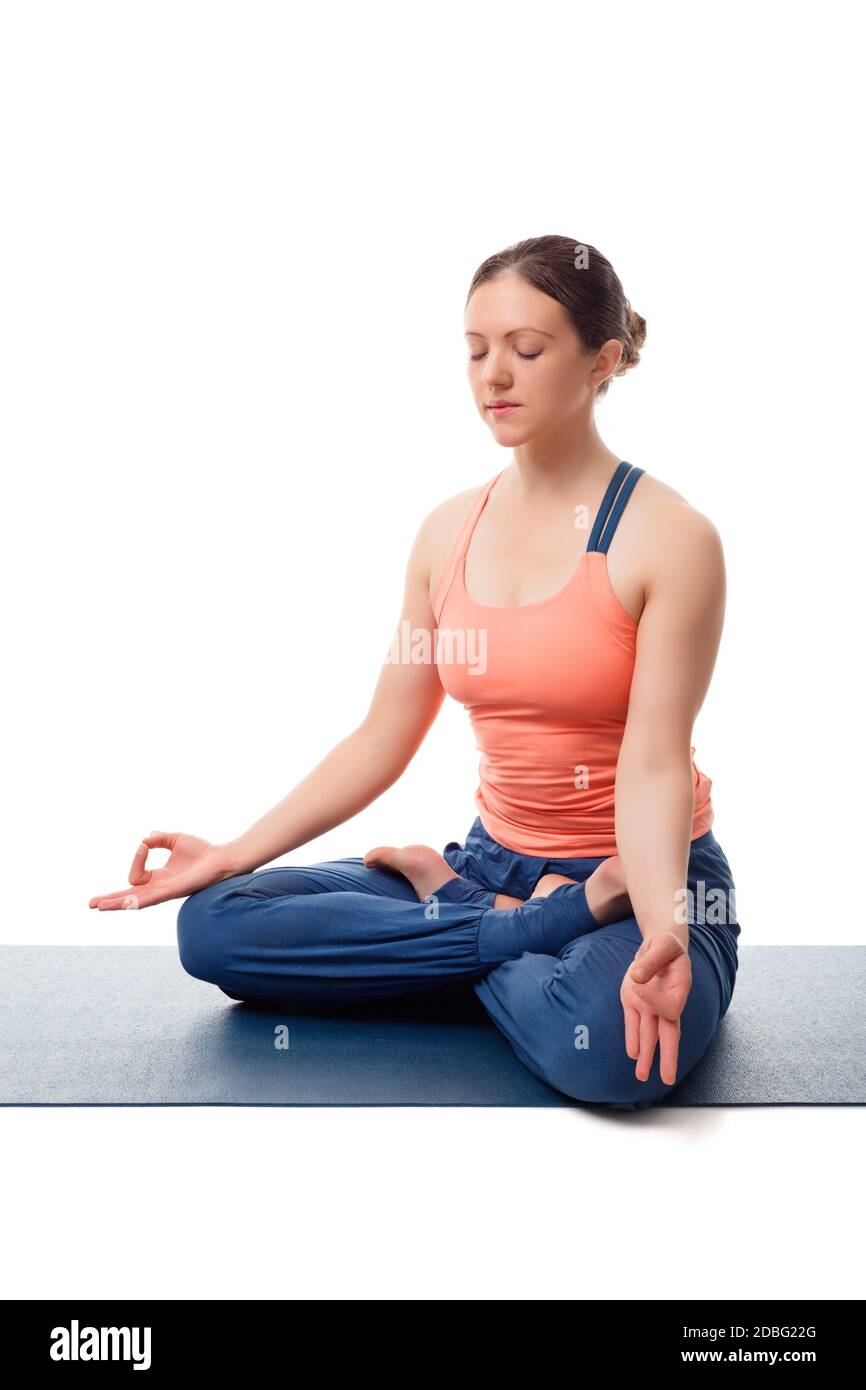 Beautiful fit yogini woman meditating in yoga asana Padmasana (Lotus ...