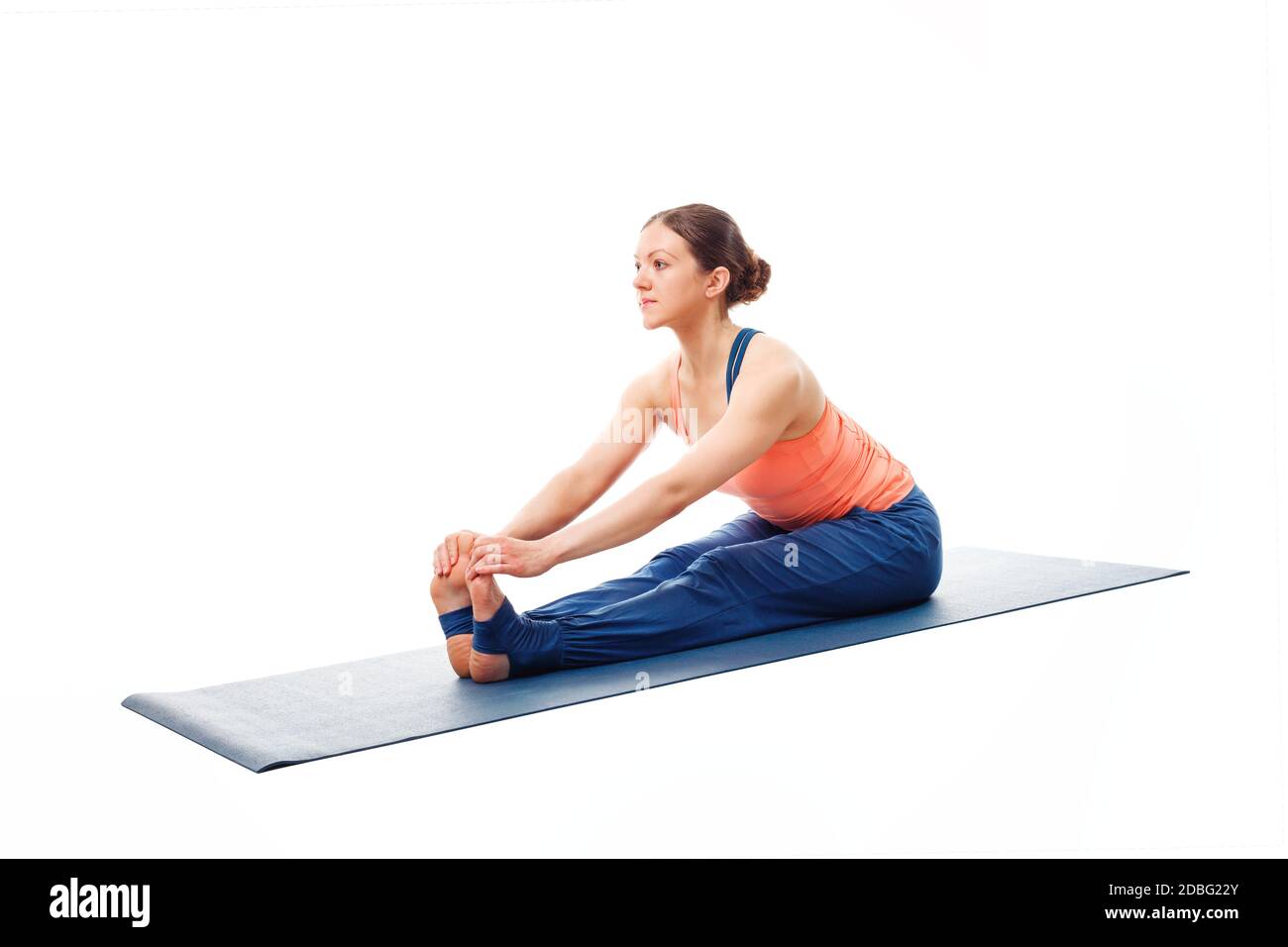 Woman doing Ashtanga Vinyasa Yoga asana Paschimottanasana - seated ...