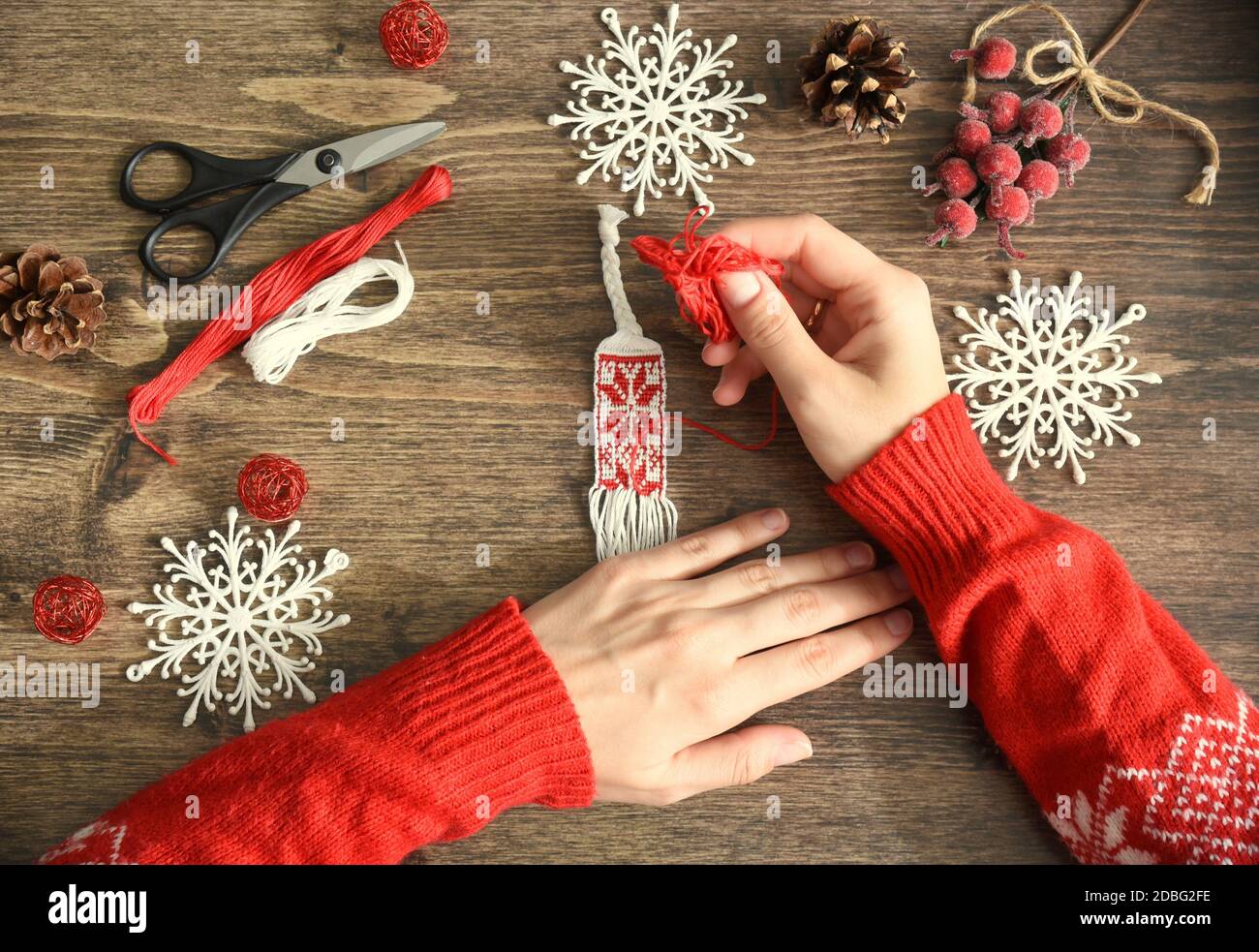 Process of weaving friendship bracelet from floss threads.female hands ...