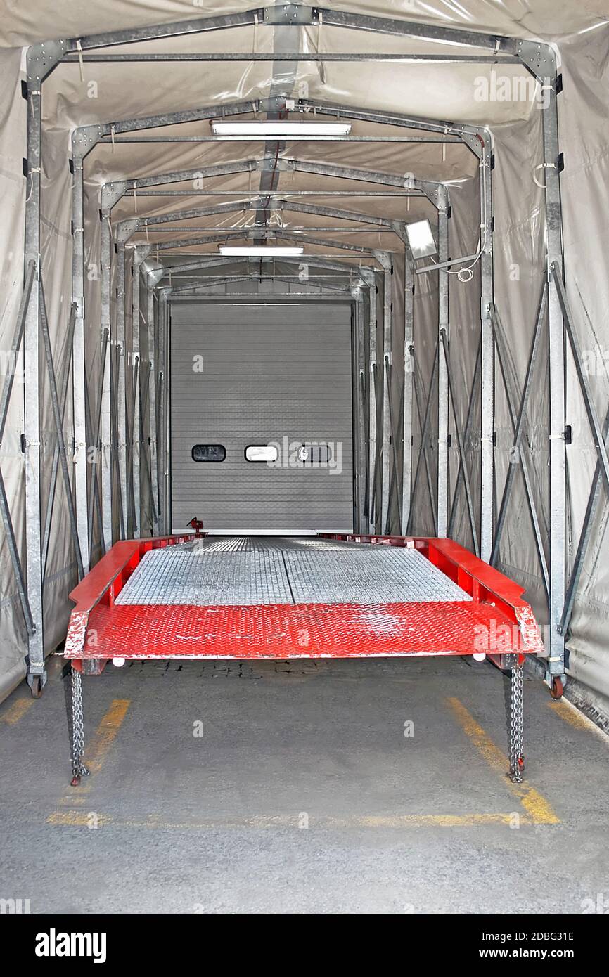 Cargo entrance with flexible tunnel and ramp Stock Photo - Alamy