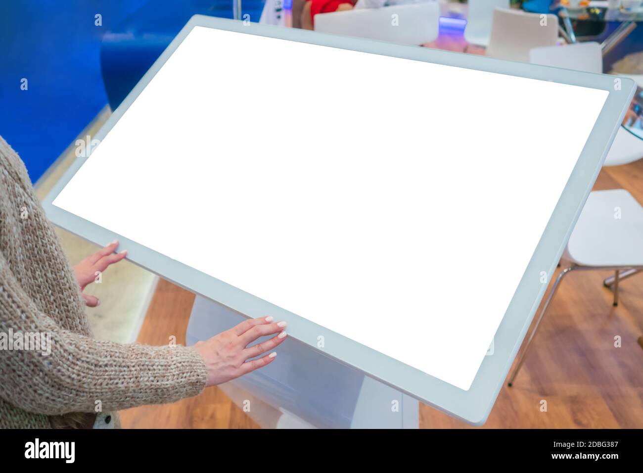 White screen concept - woman looking at blank interactive white display ...