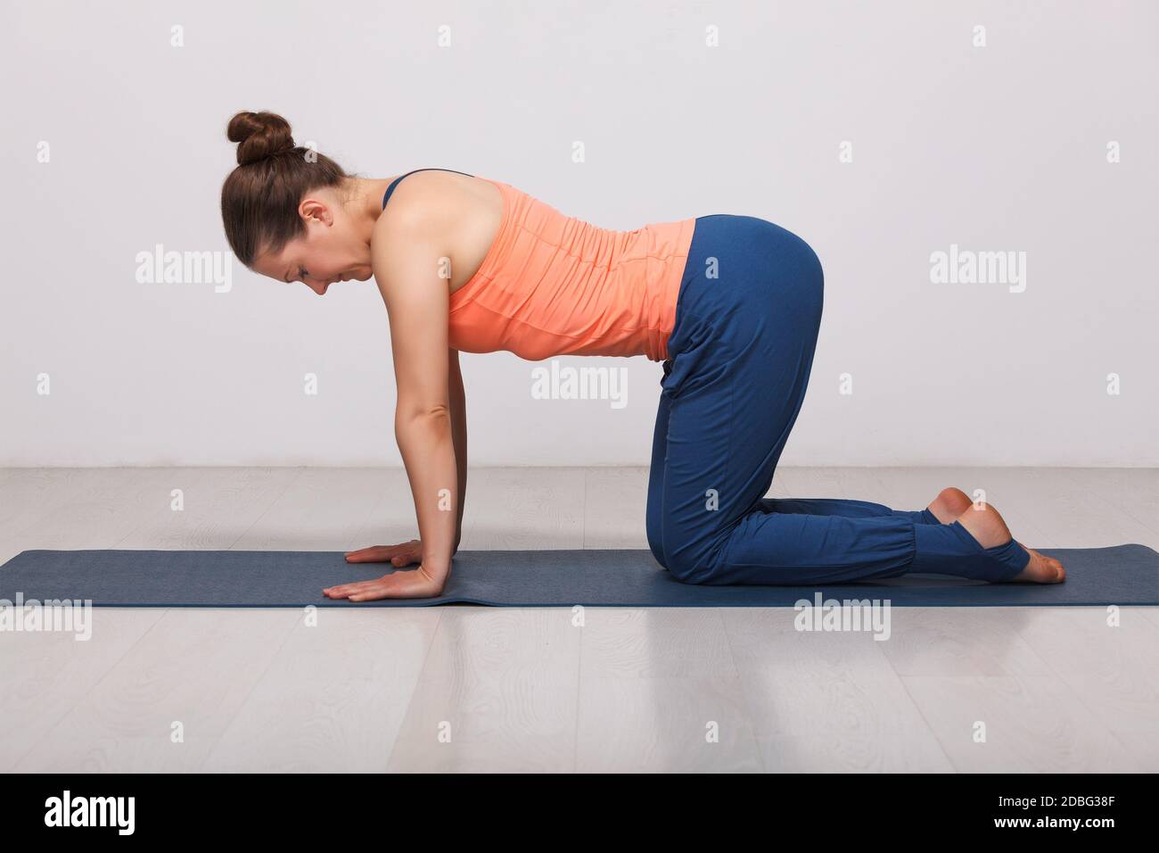 Beautiful sporty fit yogini woman practices yoga asana bitilasana - cow ...