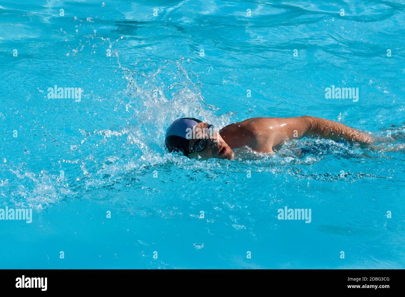 Athletic Man swimming in the pool Stock Photo - Alamy