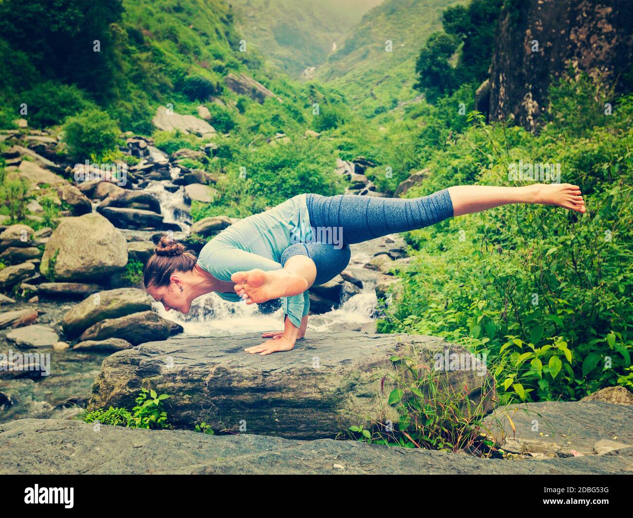 Vintage retro effect hipster style image of sporty fit woman doing yoga ...