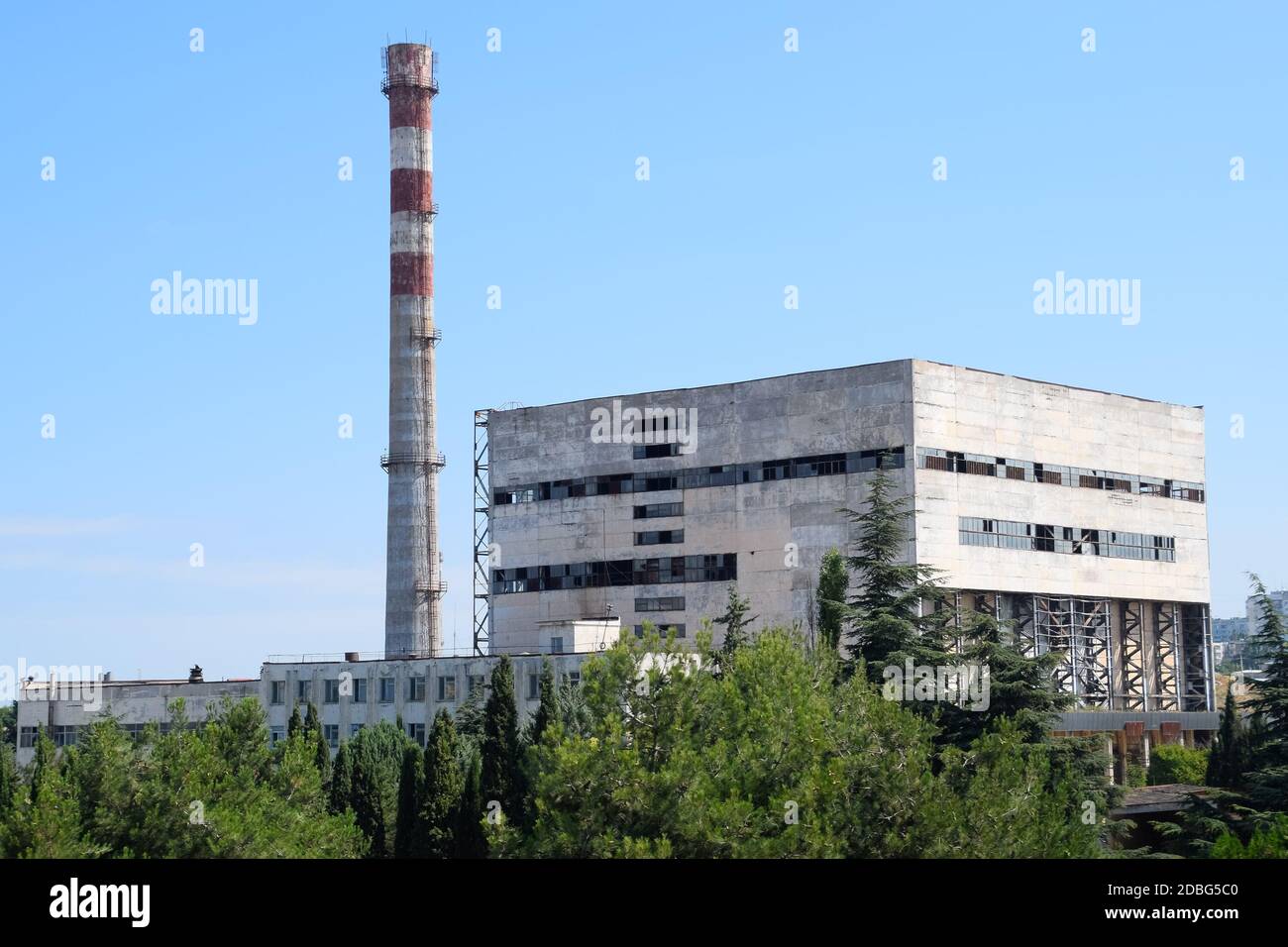 An old Soviet factory with a pipe. Abandoned Soviet industry Stock ...