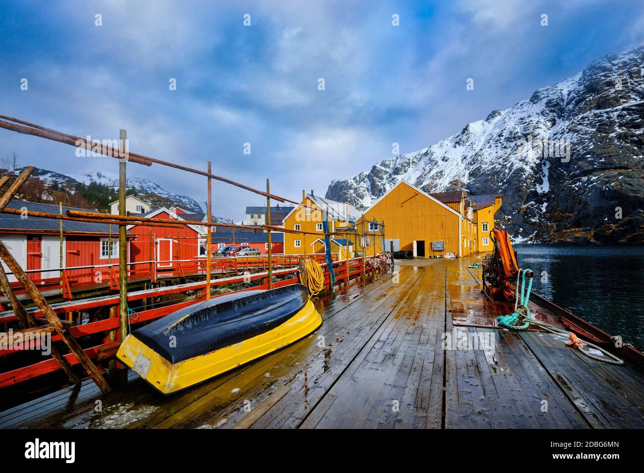 Nusfjord authentic fishing village in winter with red and yellow rorbu ...