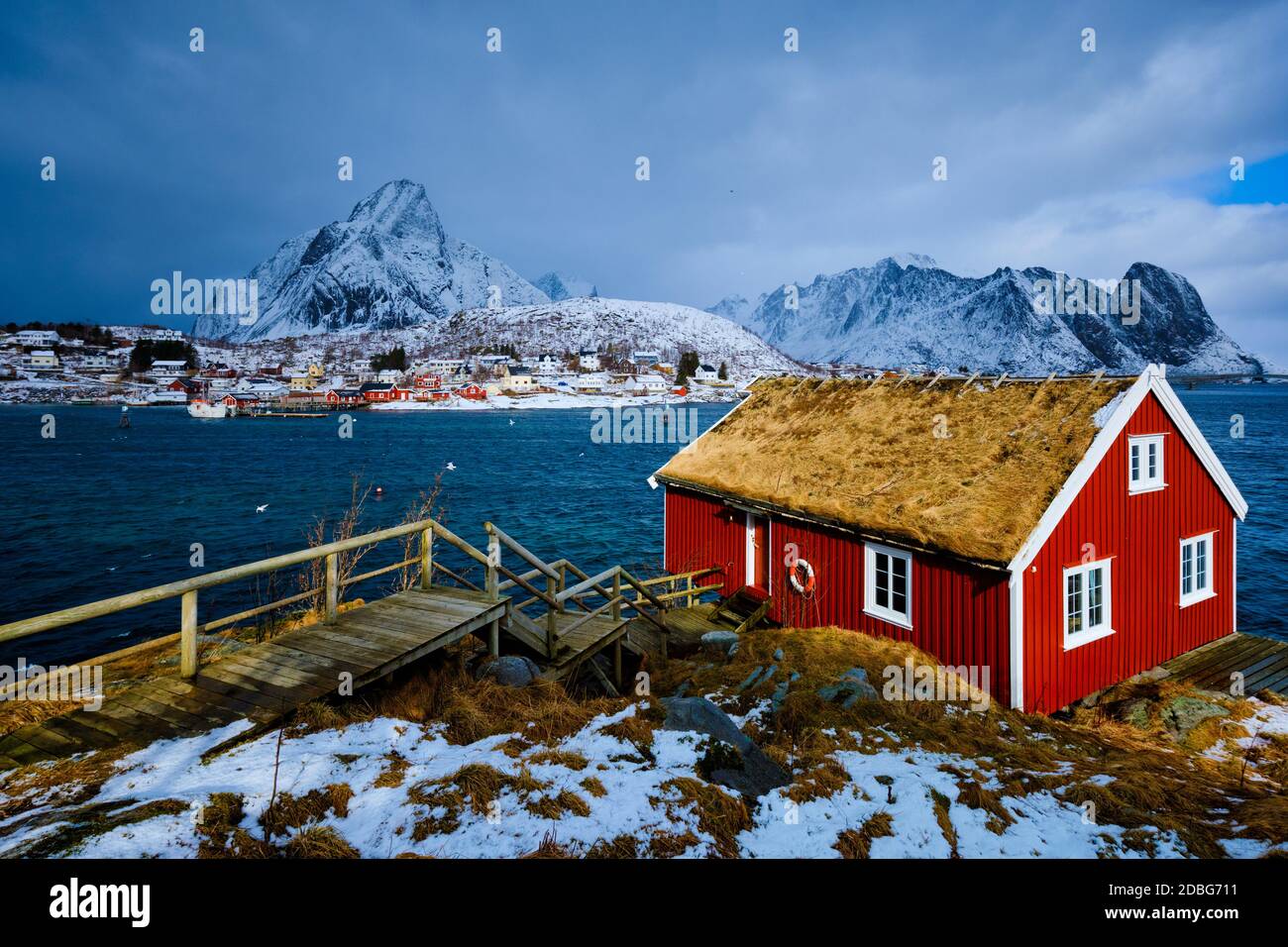 Traditional red rorbu house in Reine village on Lofoten Islands, Norway ...