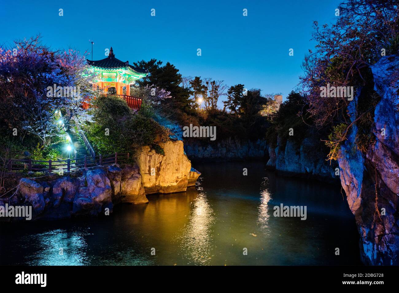 Scenic Yongyeon Pond with Yongyeon Pavilion illuminated at night, Jeju islands, South Korea ...