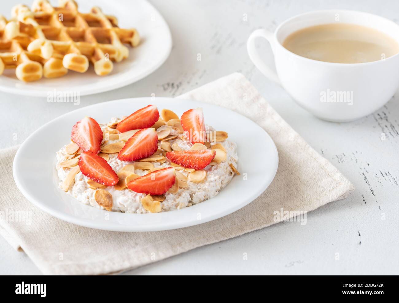Portion of homemade Bircher muesli with cup of coffee Stock Photo - Alamy