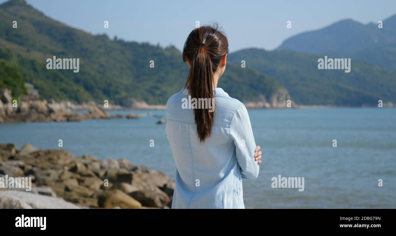 Woman look at the sea Stock Photo - Alamy