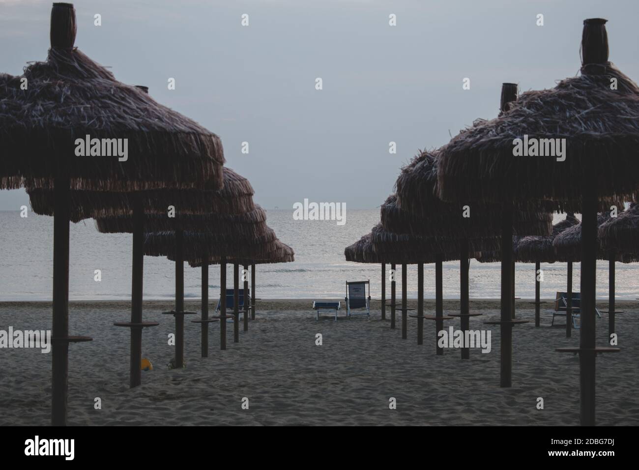 Sunset at the beach with reflection and waves Stock Photo - Alamy