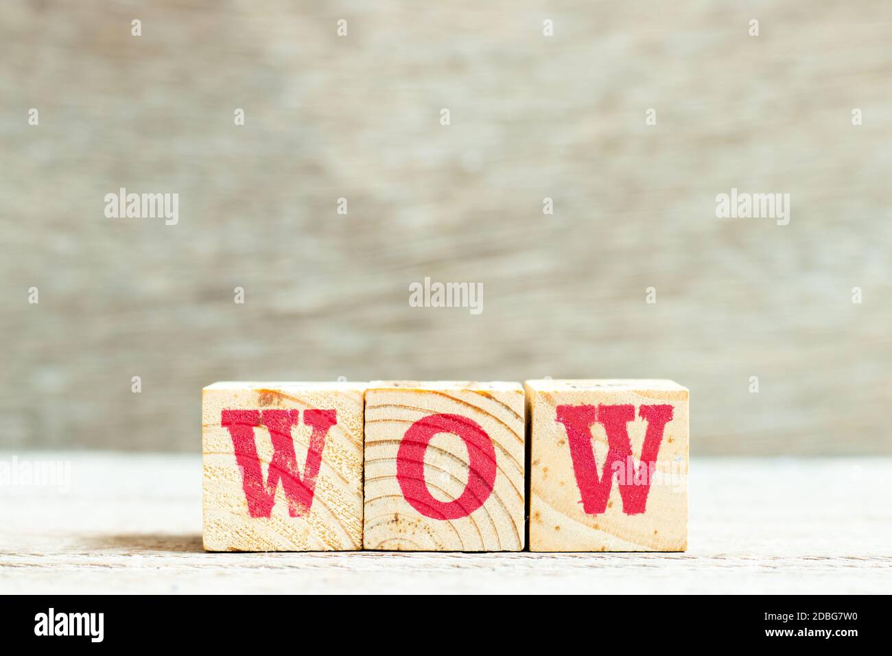 Alphabet letter in word wow on wood background Stock Photo - Alamy