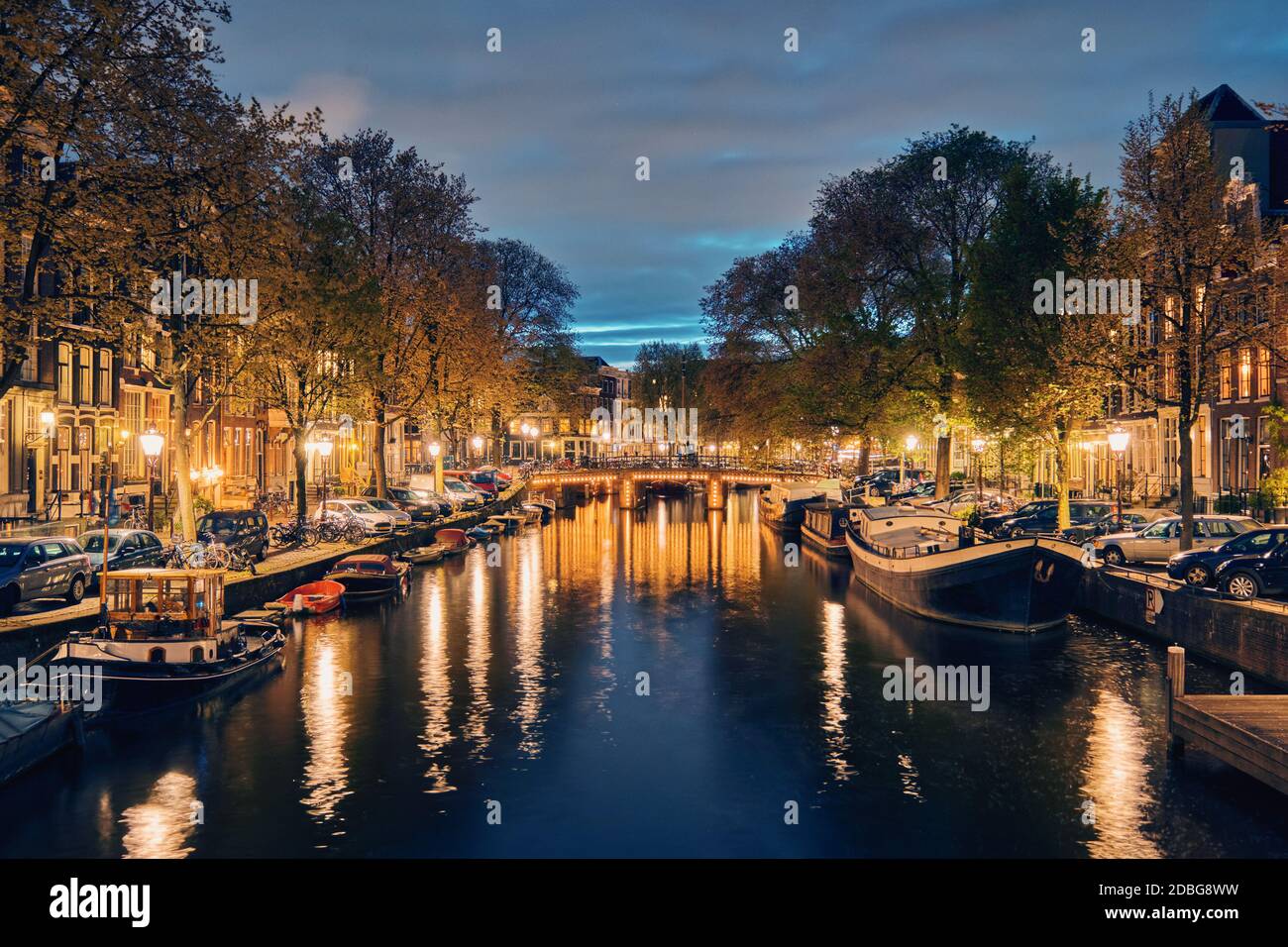 Night view of Amterdam cityscape with canal, bridge and medieval houses ...