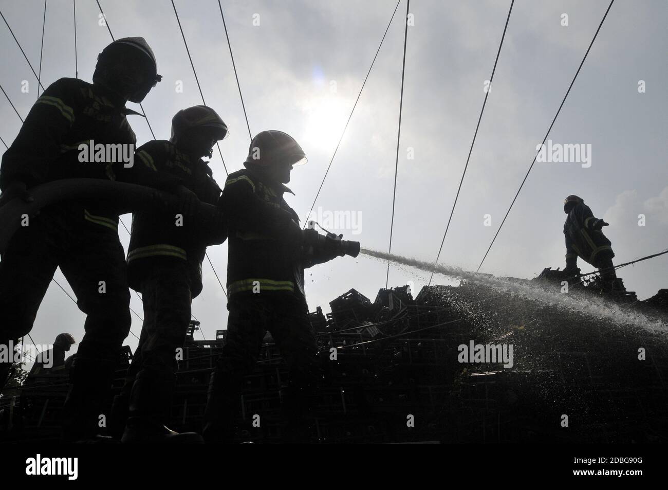 Sylhet Bangladesh, 17th November 2020. Fire fighters dousing a massive ...