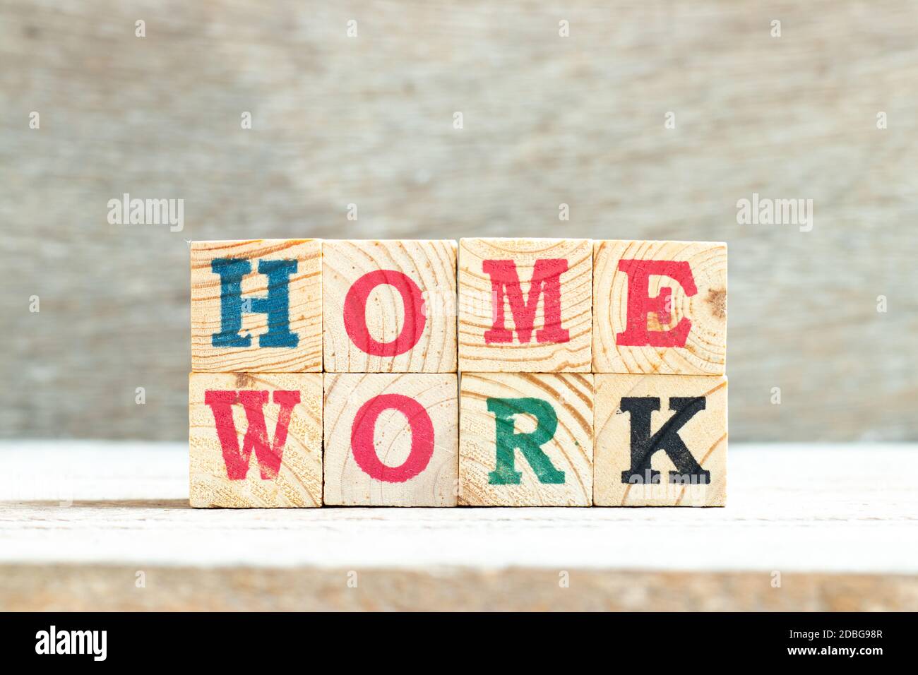 Alphabet letter block in word homework on wood background Stock Photo ...