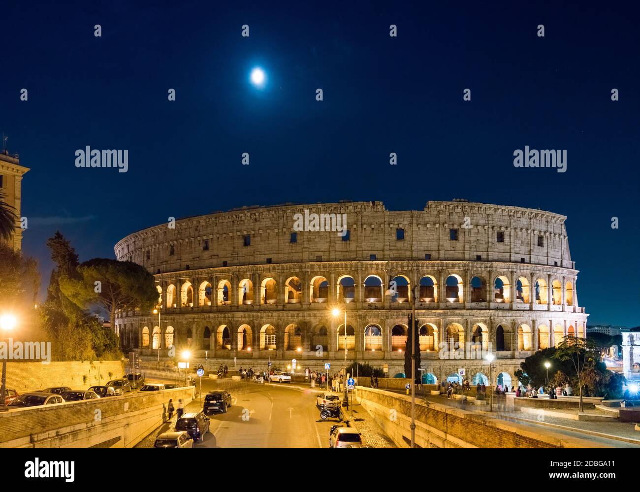 Nighttime view of the Colosseum in Rome, Italy with waning gibous moon ...