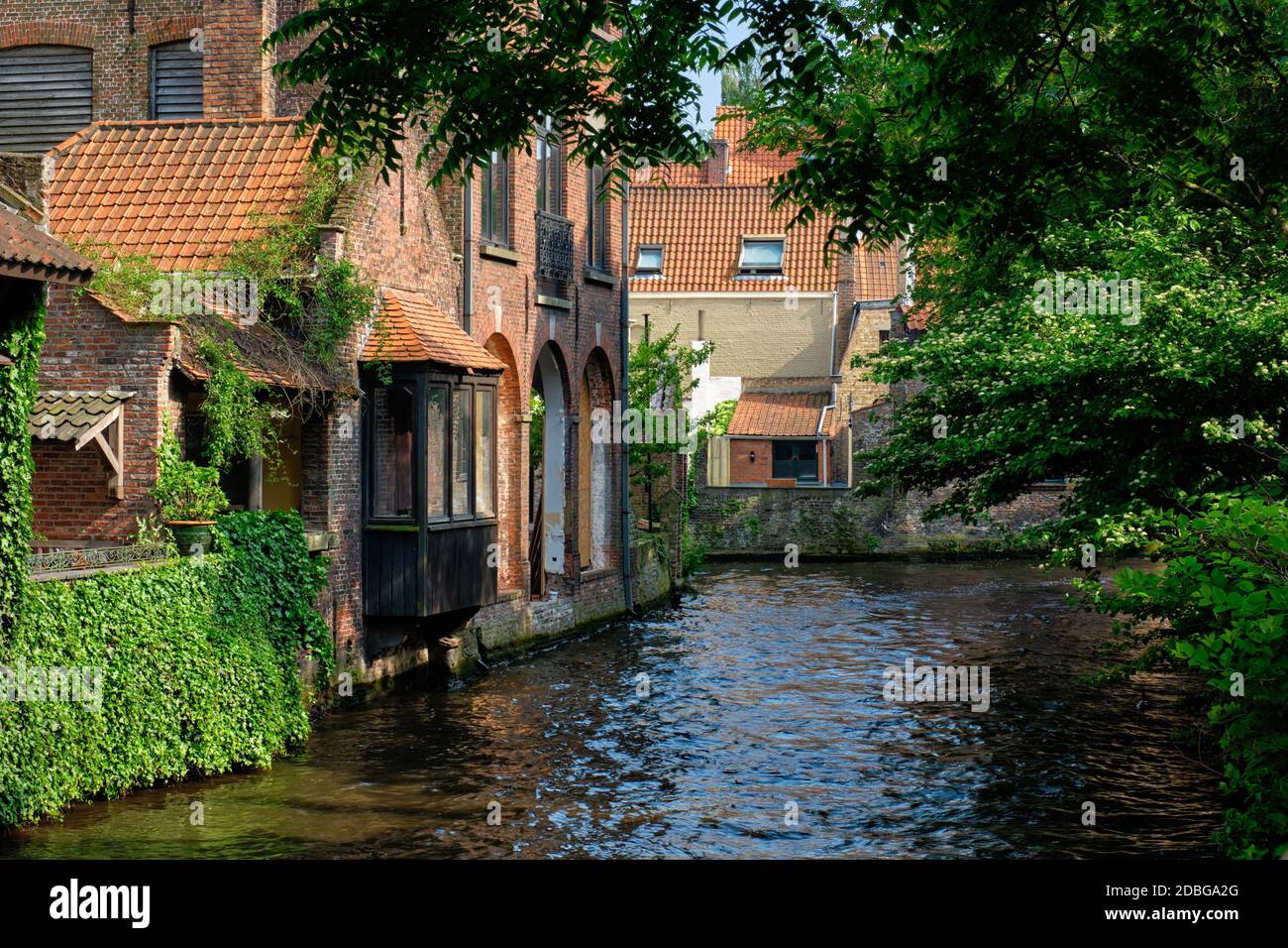 Canal between old houses of famous Flemish medieval city Brugge. Bruges ...