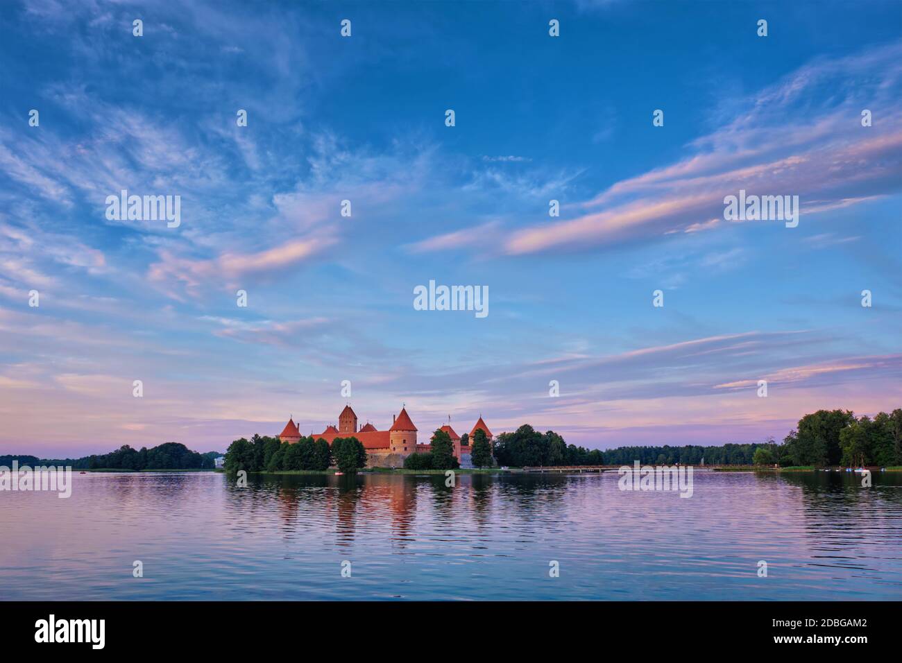 Trakai Island Castle in lake Galve, Lithuania on sunset with dramatic ...