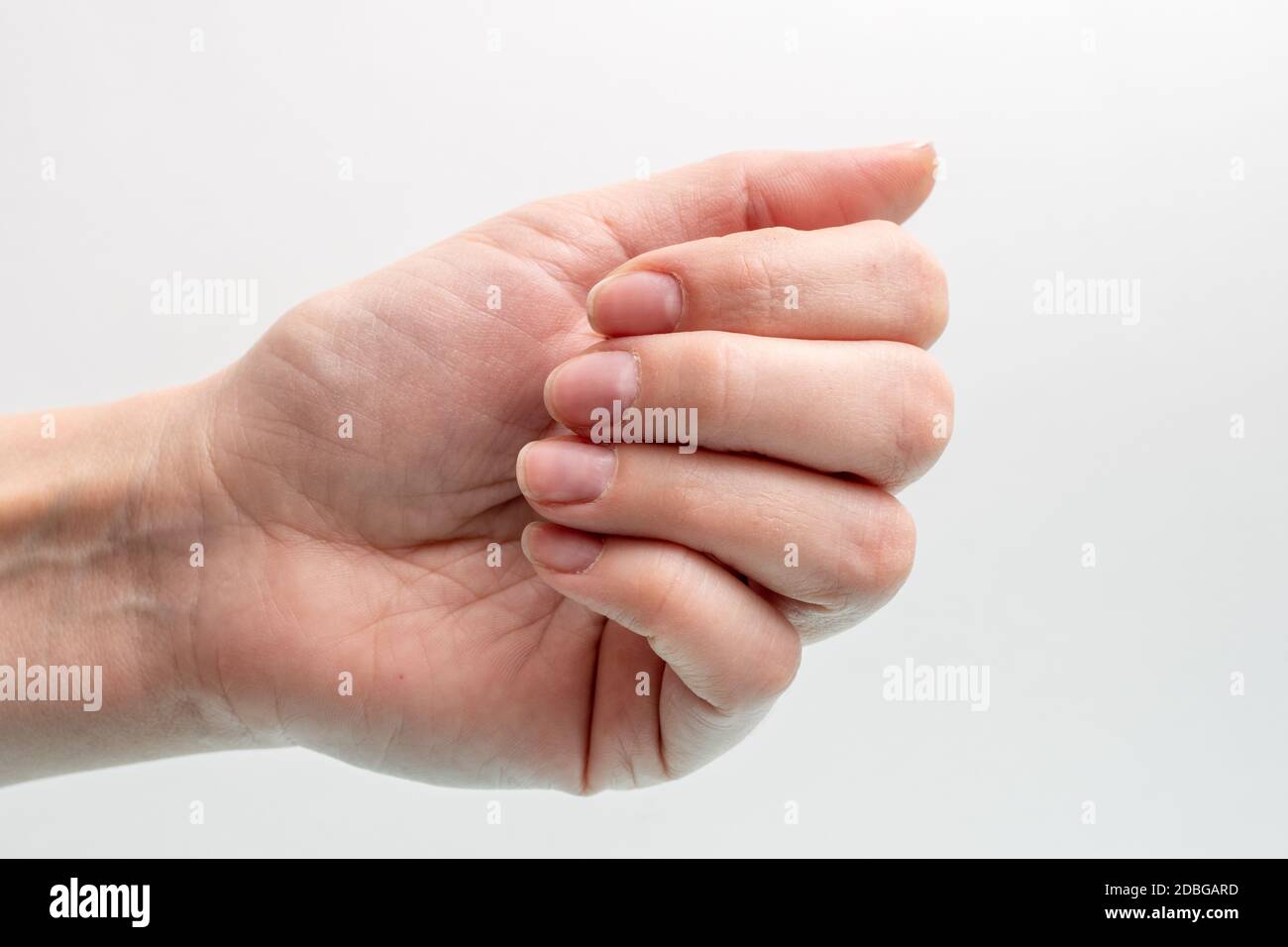 Close-up of a Caucasian female hand with natural unpolished nails ...