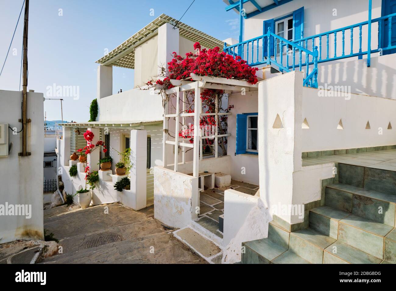 Picturesque narrow street with traditional whitewashed houses with ...