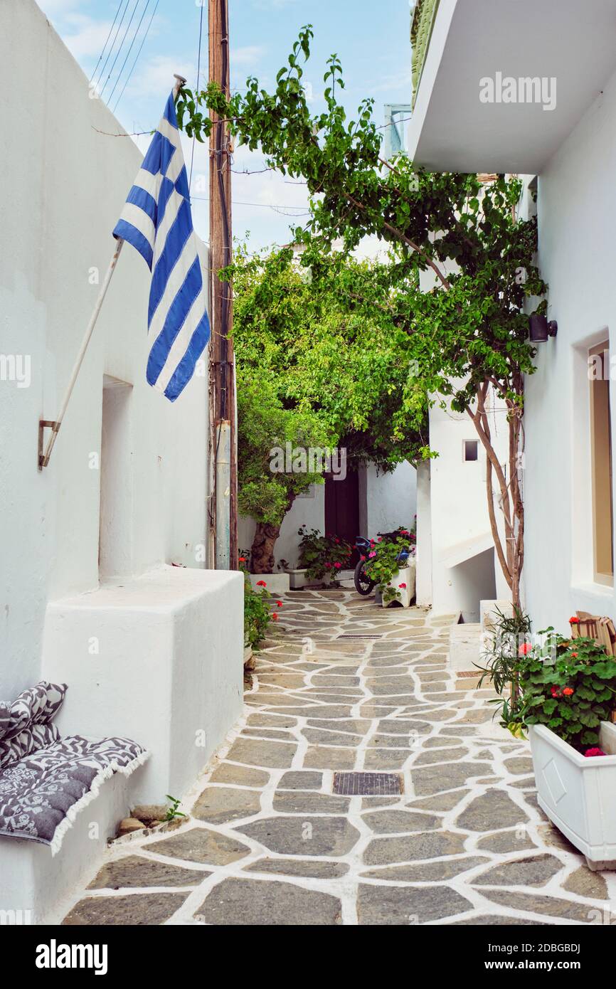 Picturesque narrow street with traditional whitewashed houses with ...