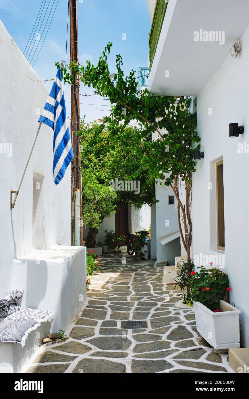 Picturesque narrow street with traditional whitewashed houses with ...