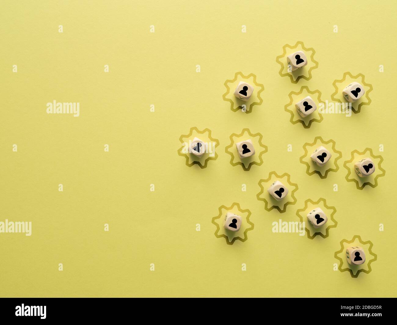 Small wooden blocks with character icons and a gear shape around them ...