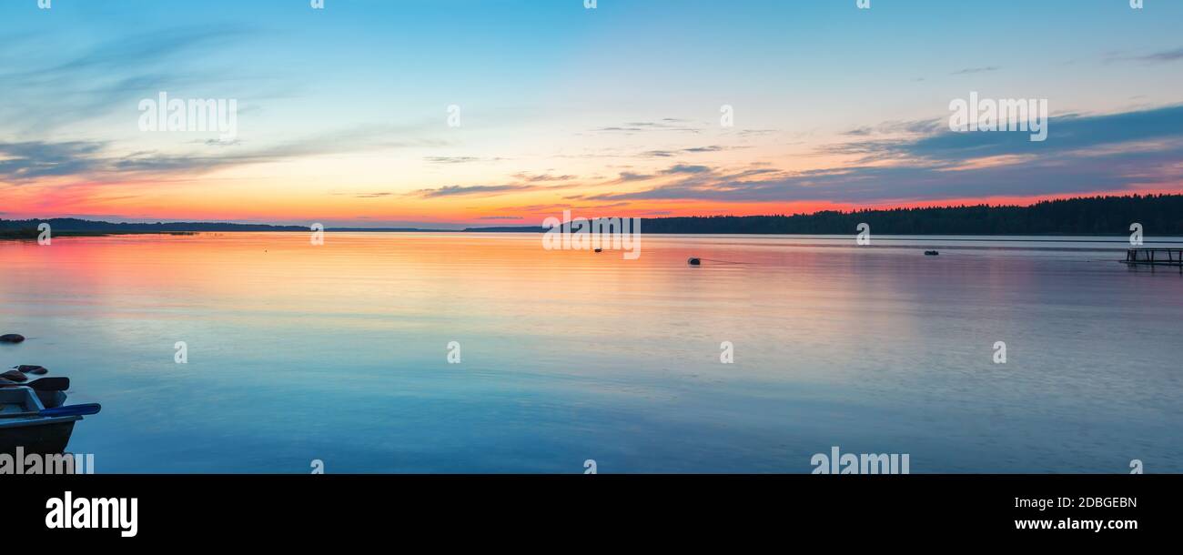 Beautiful landscape with calm sunset over forest lake Stock Photo - Alamy